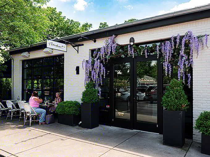Café Patachou's wisteria-draped entrance invites you into a world where breakfast is never rushed and coffee comes with conversation.