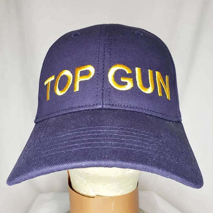 This "Top Gun" cap isn't just headwear—it's an invitation to feel the need for speed while keeping your hair perfectly in place.