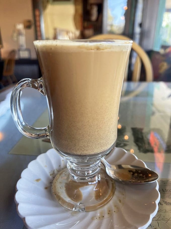 A caramel latte served with such elegance it makes you want to extend your pinky while simultaneously licking the glass clean.