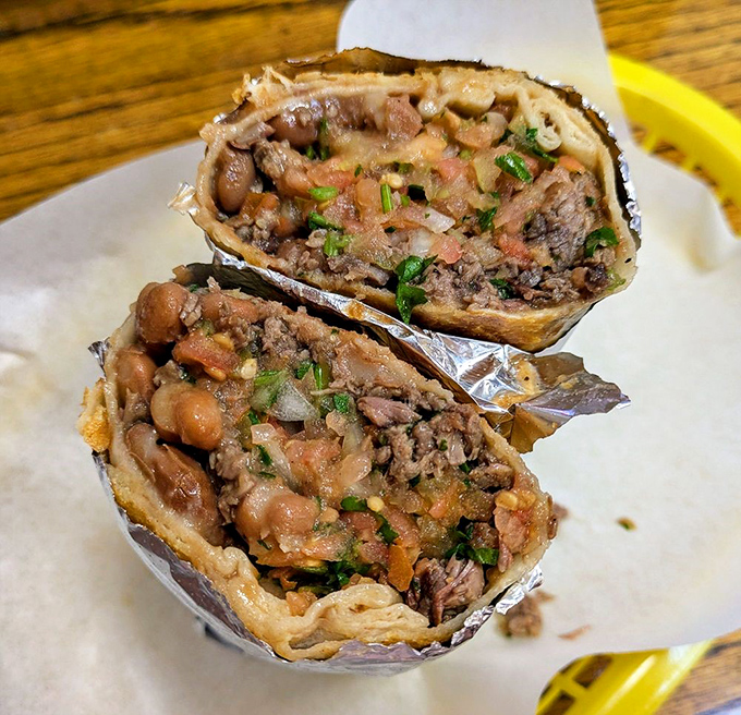 Cross-section of happiness. No rice filler here—just the harmony of beans, meat, and fresh ingredients in perfect proportion.