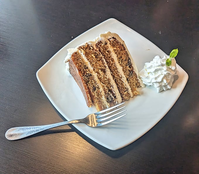 Layer upon layer of moist cake separated by creamy frosting—this isn't just dessert, it's therapy on a plate.