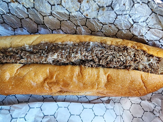 The cross-section reveals the truth: perfectly chopped meat and melted cheese in harmonious balance. Sandwich architecture at its finest.