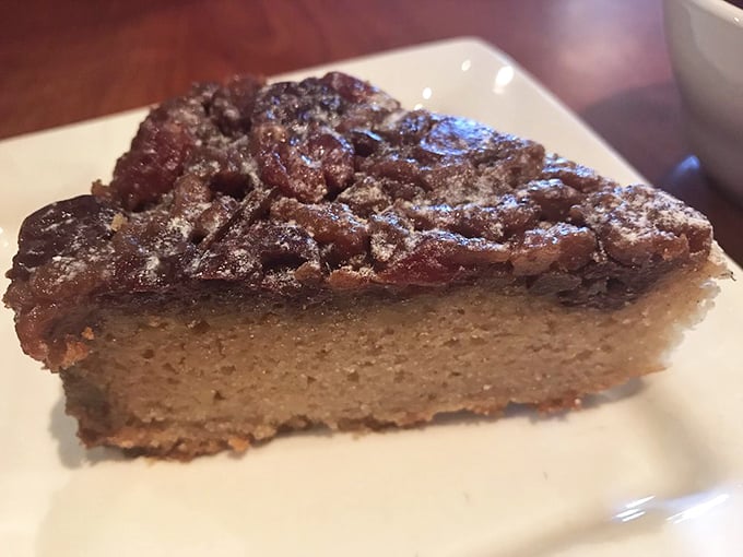 A slice of cherry pecan pie that makes you wonder if you should skip straight to dessert next time. Life's uncertain—eat the pie first!