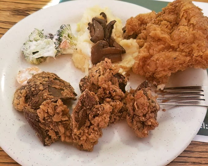 Crispy chicken livers for the adventurous soul, paired with creamy mashed potatoes and gravy—a Southern delicacy that divides families but conquers hearts.