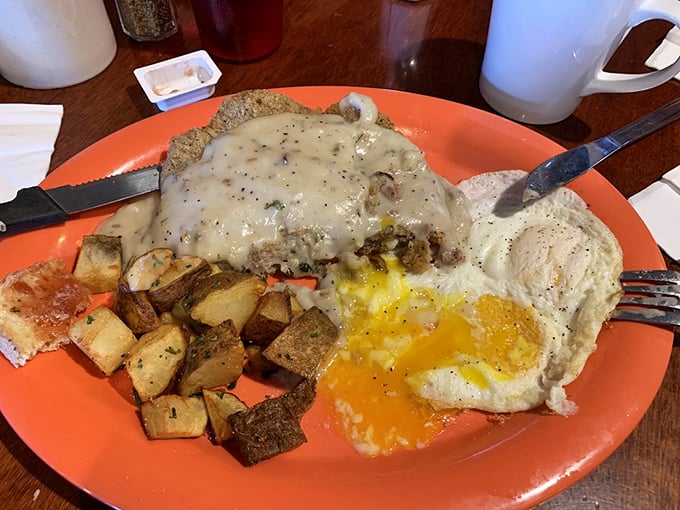Chicken fried steak smothered in country gravy—comfort food that hugs you from the inside out while sunny-side eggs add a cheerful hello.