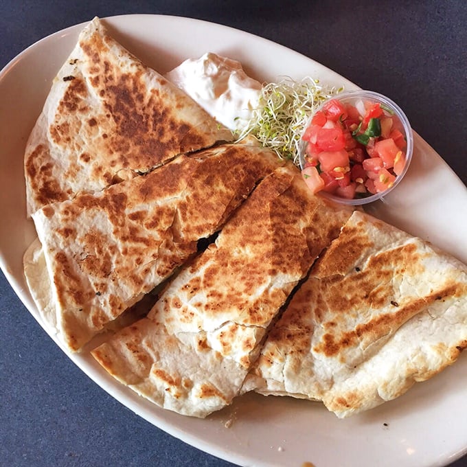 A quesadilla that's achieved the perfect golden-brown exterior—the culinary equivalent of a perfect summer tan, but much more delicious.