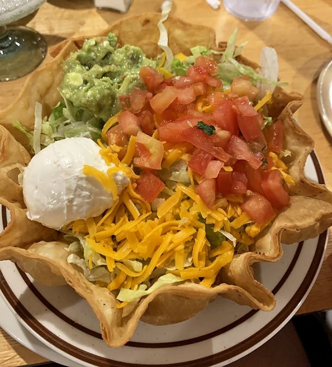 Not just a salad bowl—it's an edible stadium where fresh ingredients play the most delicious game in town. That sour cream dollop is the MVP.