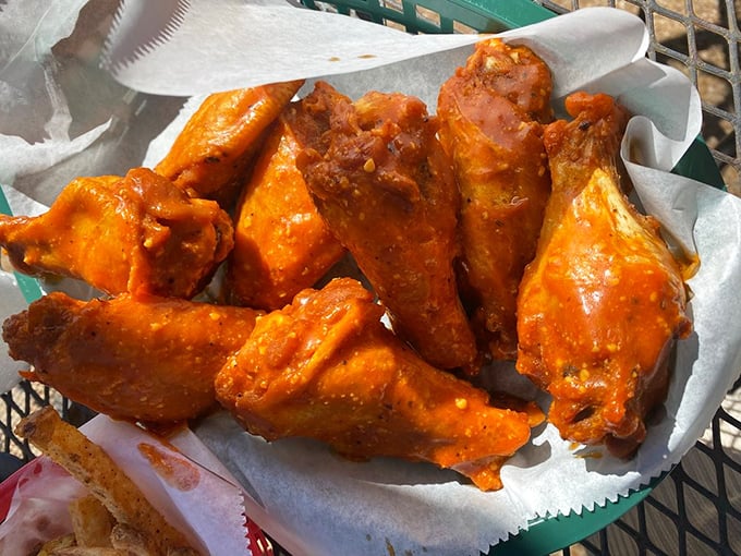Buffalo wings glowing with tangy promise. These aren't just wings – they're flavor vehicles delivering happiness directly to your taste buds.