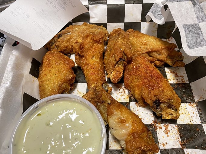 Crispy buffalo wings with blue cheese create the kind of finger-licking experience that requires multiple napkins.