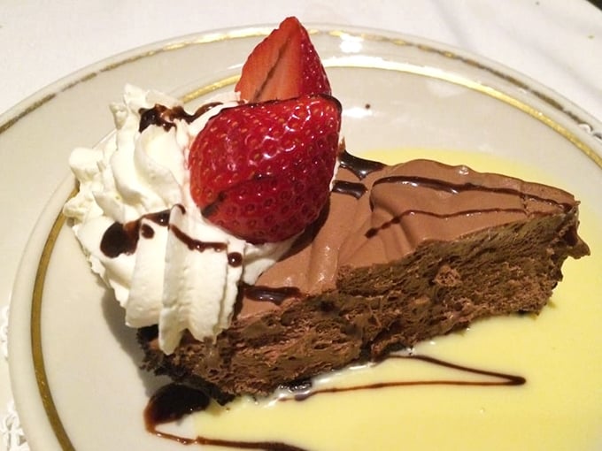Chocolate mousse that puts ordinary desserts to shame. Crowned with fresh strawberries and whipped cream, it's the sweet finale that makes you contemplate ordering a second.