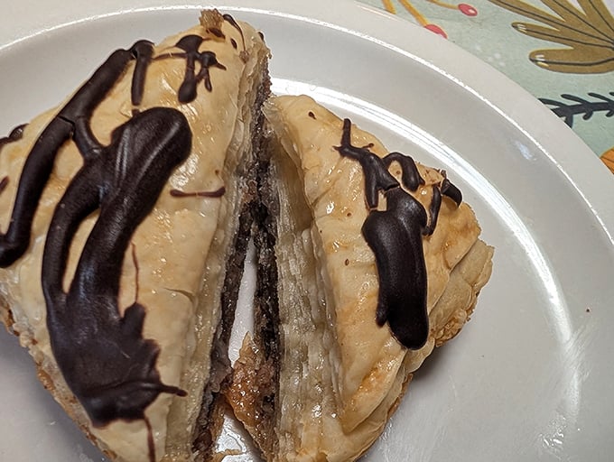 This dessert doesn't just satisfy your sweet tooth – it throws a party for it with layers of chocolate, baklava, and cheesecake.