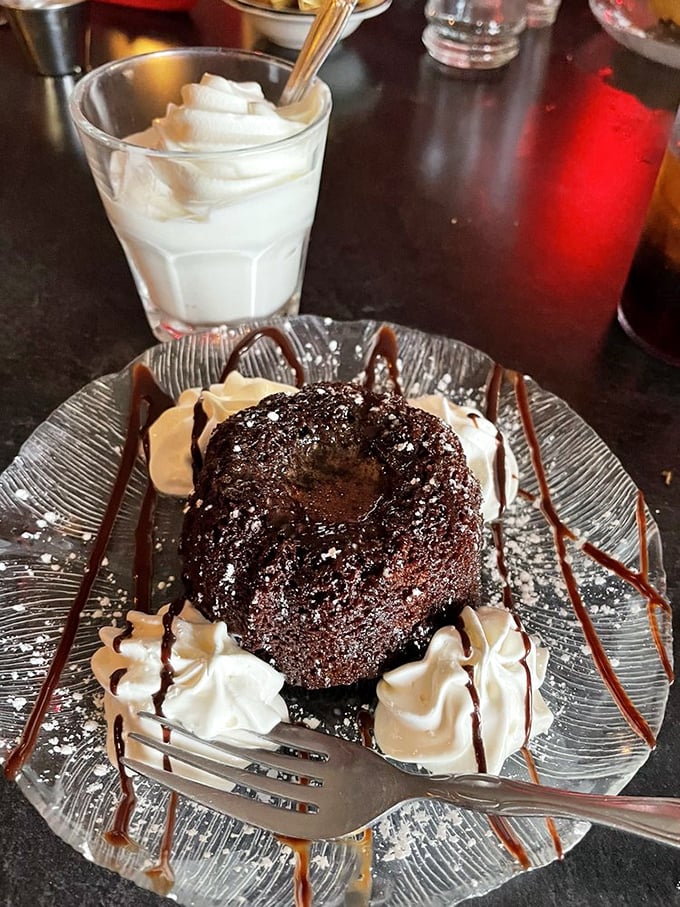 Chocolate lava cake that erupts with warm fudge when your fork breaks the surface—paired with a glass of milk for that nostalgic touch.