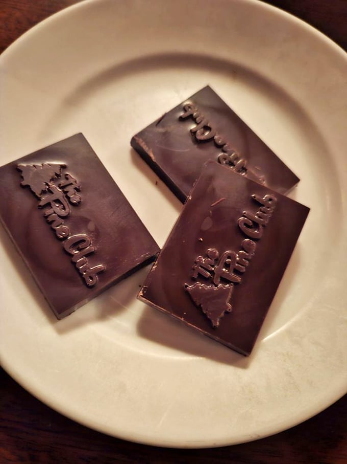 The meal's sweet finale – custom chocolates bearing The Pine Club's name, because even dessert knows whose house you're in.