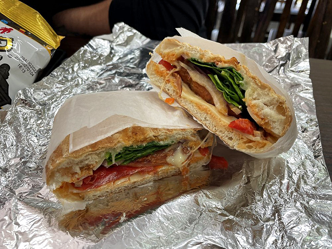 This panini's grill marks tell a story of transformation, where bread becomes crispy vessel for a medley of fillings that melt together in harmony.