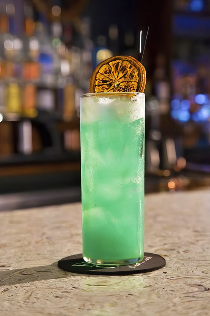 This isn't just a cocktail—it's a beachside vacation in a glass, with that dehydrated citrus garnish serving as both decoration and a hint of what's to come with each sip.