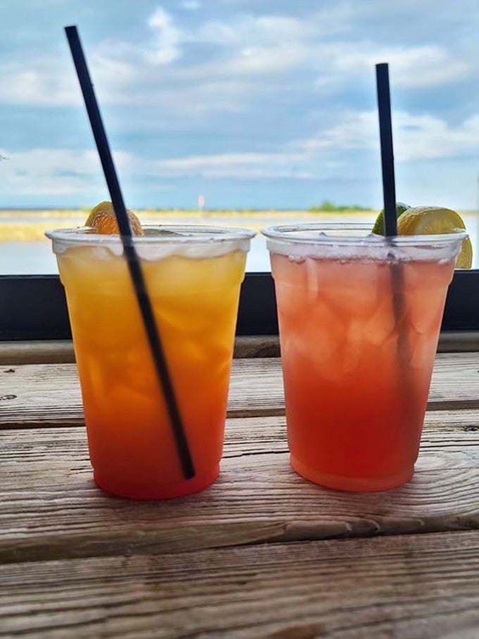 Colorful cocktails with a waterfront view – liquid sunshine in glasses that taste even better than the postcard-worthy scene suggests.