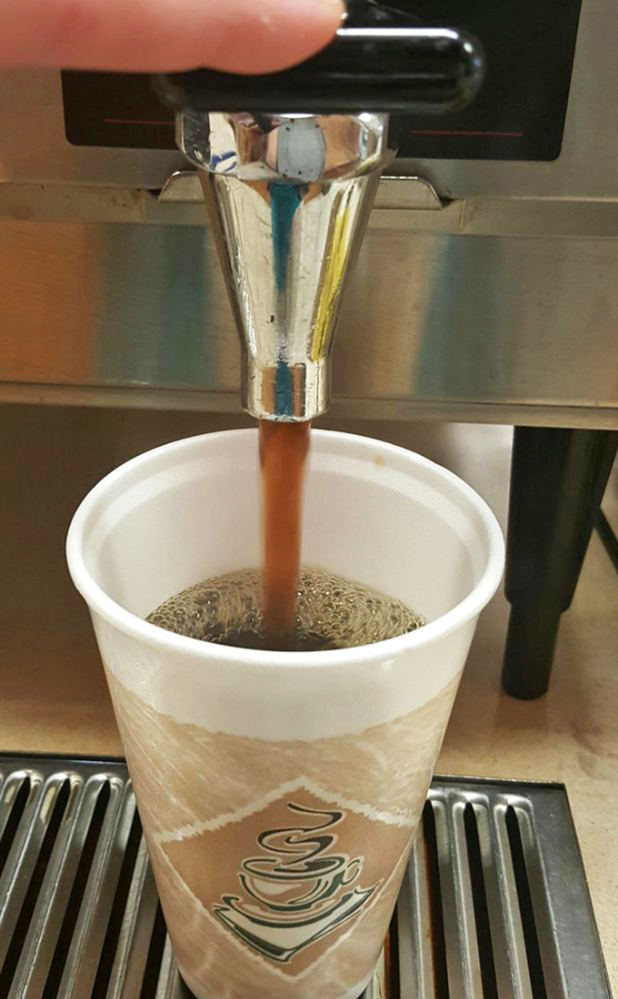 Coffee being dispensed like liquid gold—the perfect companion to whatever baked treasure you've selected from the display case.