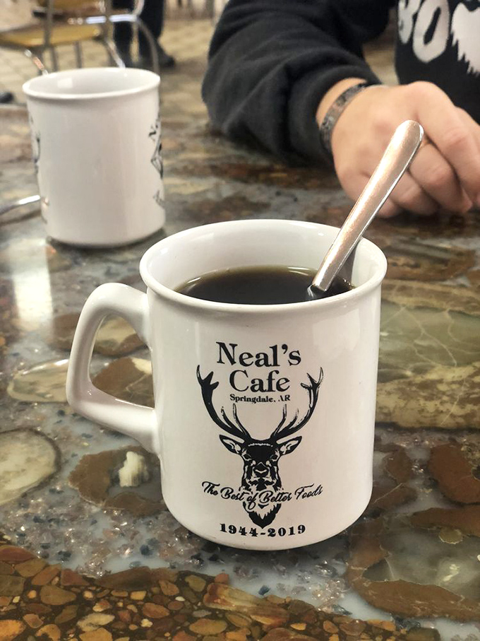 The iconic Neal's Cafe mug—featuring their deer logo and "Best of Better Foods" slogan—makes that morning coffee taste even better.