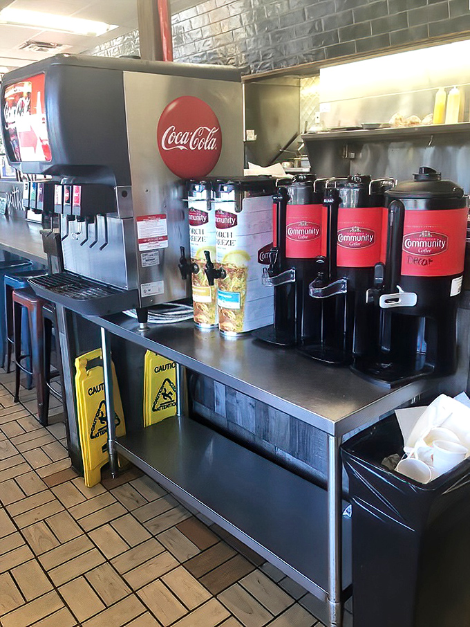 The coffee station—where morning dreams begin. Those Community Coffee urns promise the liquid courage needed to face the day.