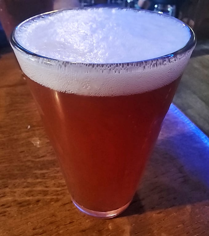 A perfectly poured beer with that ideal foam-to-liquid ratio. The amber color promises flavor complexity that mass-produced options can only dream about.