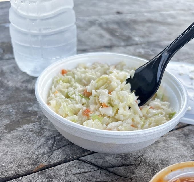 Coleslaw that knows its supporting role: creamy enough to complement the smoke without drowning in mayo—barbecue's perfect dance partner.