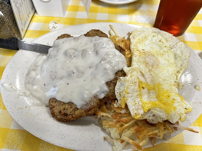 Country fried steak smothered in gravy with eggs sunny-side up – the breakfast equivalent of a warm hug from your favorite aunt.