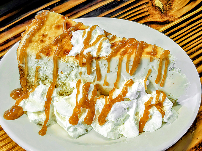 A cloud of whipped cream drizzled with caramel sauce—this dessert doesn't just end your meal, it provides the grand finale it deserves.