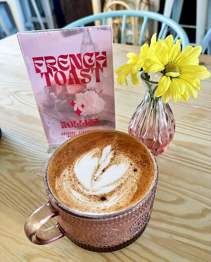 Coffee served in a copper mug with latte art so pretty you almost don't want to drink it. Almost.