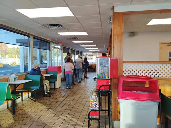 The lunch line forms with the patience of pilgrims – locals and tourists united in the universal language of barbecue anticipation.
