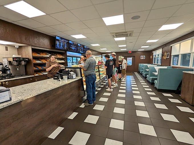 The morning pilgrimage to Bill's counter – where strangers become friends united by the universal language of "I'll take a half-dozen, please."