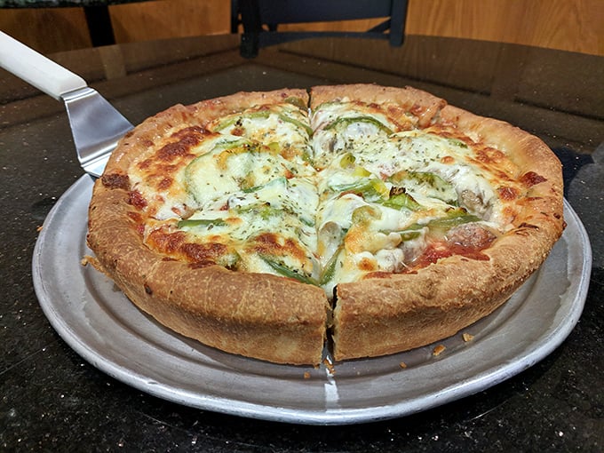 This deep dish isn't just a pizza – it's architecture, it's engineering, it's a testament to Chicago's belief that more is indeed more.