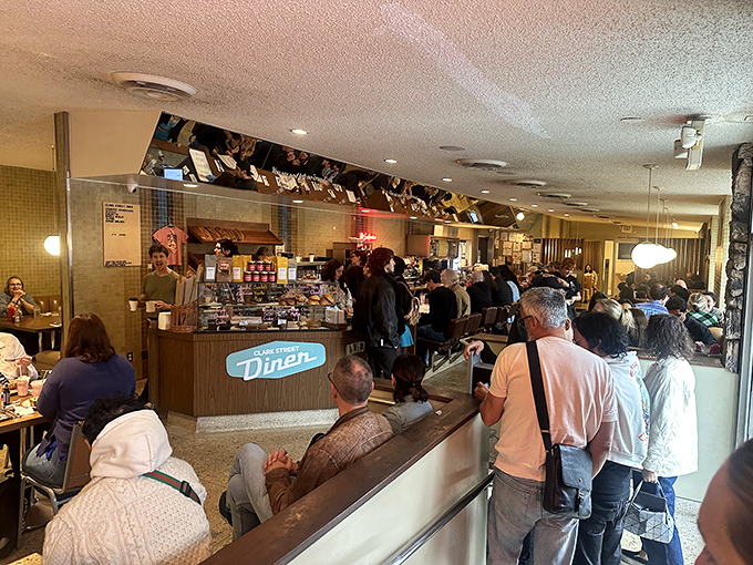 The lunch counter buzz—where strangers become temporary neighbors united by the universal language of "pass the ketchup, please."