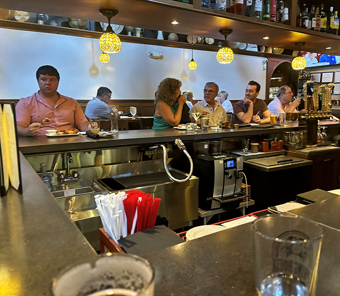 The bar buzzes with conversation and clinking glasses—proof that good food and drink still bring people together better than any social media.