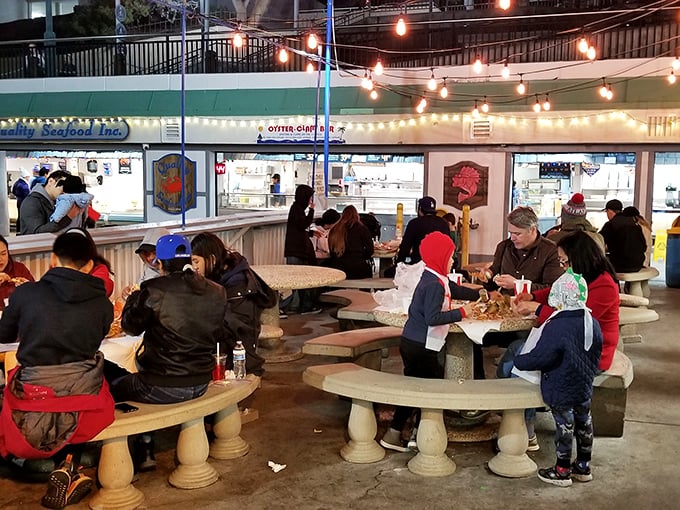 Happy diners proving that good seafood is the universal language of contentment – no translation needed here.