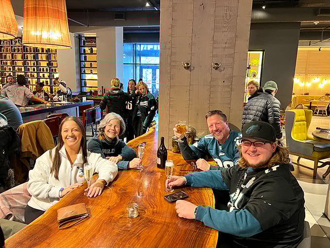 Happy diners in their natural habitat, contemplating whether dessert is really optional.