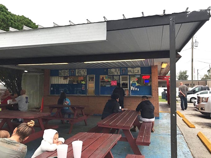The outdoor seating area buzzes with locals who know the secret of Bantam Chef. These aren't tourists—they're regulars who measure their lives in fish sandwiches.