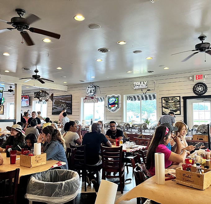 A full house of happy diners proves the universal truth: nothing brings humans together like the shared struggle of cracking open stubborn crab shells.
