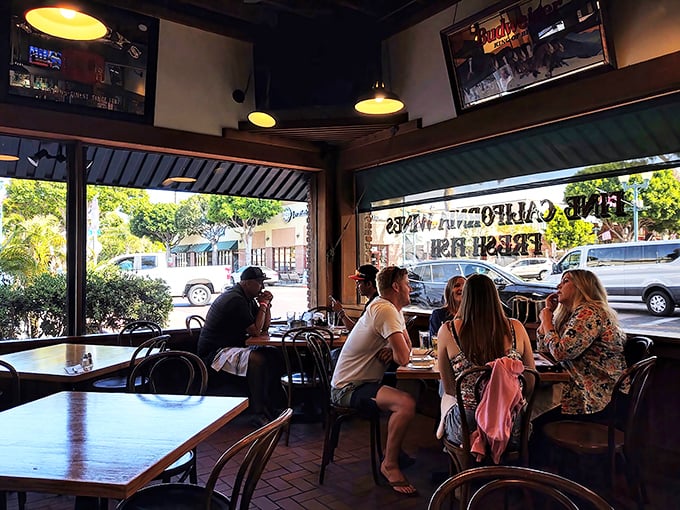 The front dining area offers prime people-watching through those big windows—because good food tastes even better with a side of Main Street ambiance.