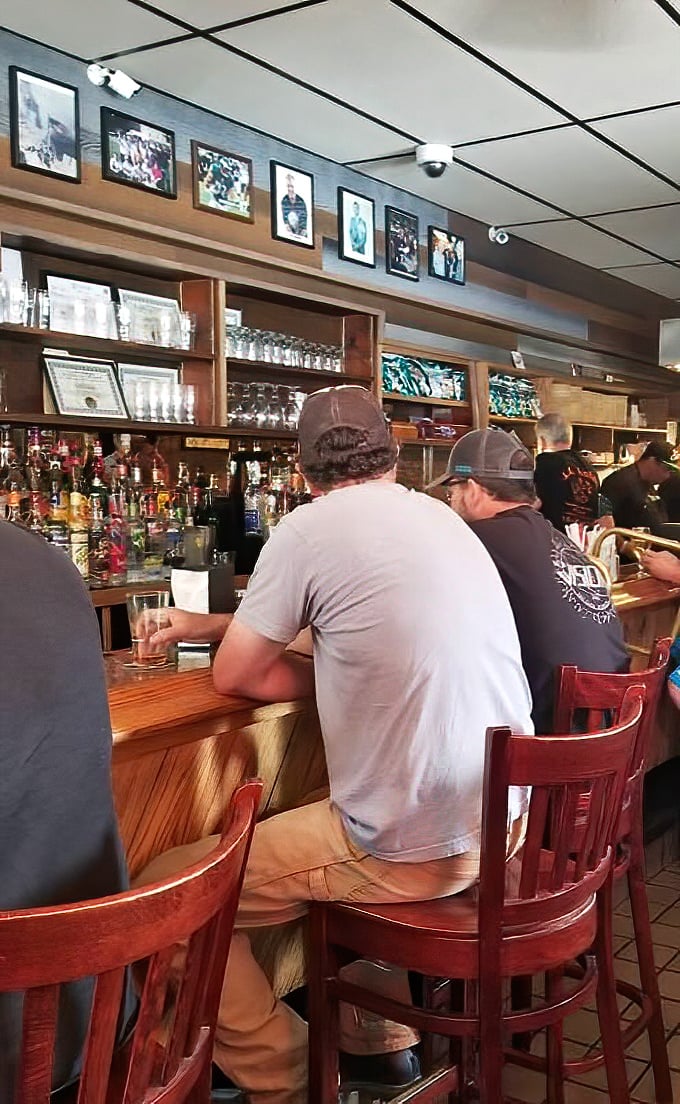 The bar at Nick's isn't about fancy mixology; it's where generations of Philadelphians have celebrated victories and nursed defeats over cold beers and hot sandwiches.