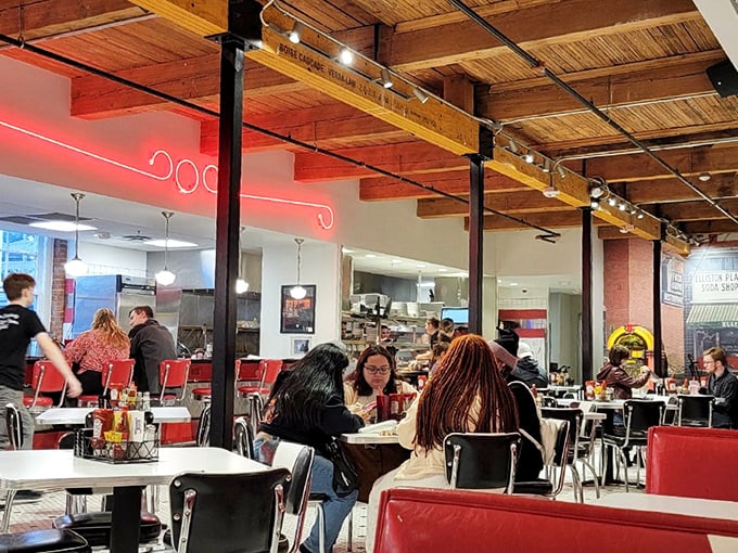 Where strangers become neighbors under the glow of neon lights, sharing nothing but space and the universal language of "mmm."
