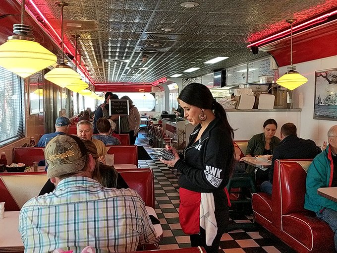 The choreographed dance of servers and diners plays out beneath pressed tin ceilings and pendant lights. Every great diner has its own rhythm.