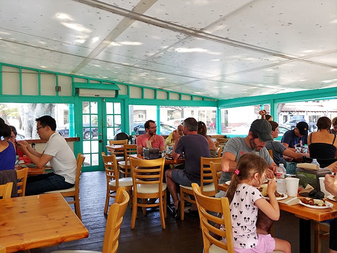 Families, couples, solo diners—all drawn to these tables by the universal language of exceptional Mexican street food.