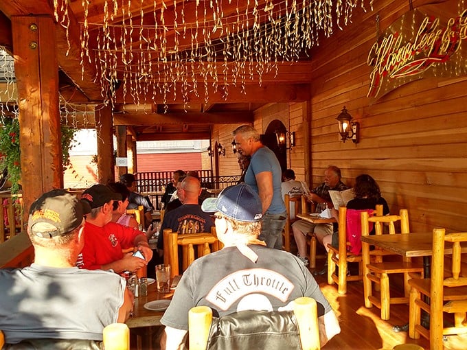 The outdoor porch – where cowboys, tourists, and locals gather under twinkling lights to swap tales and savor the evening.