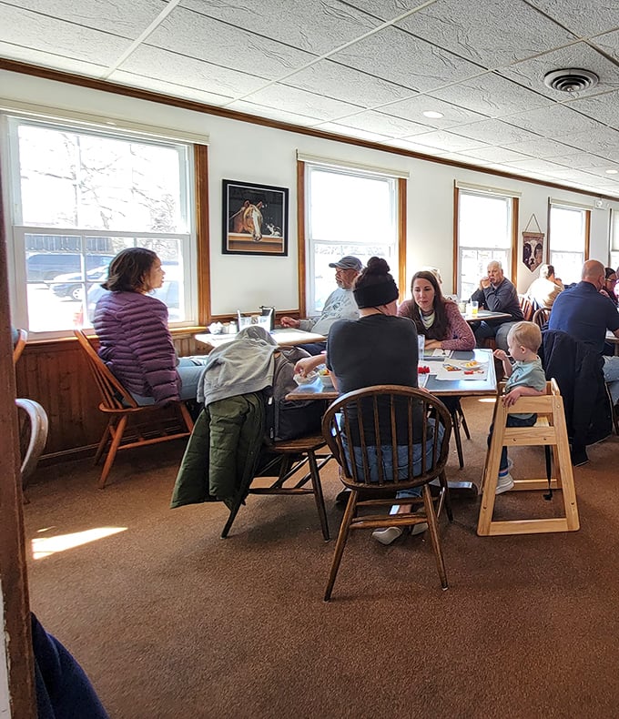 Families gathering around tables filled with breakfast bounty—creating memories that will last longer than the maple syrup on their plates.