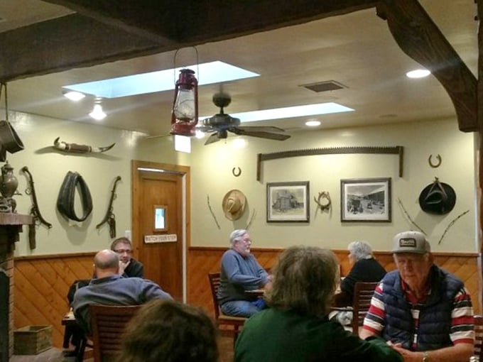 Where cowboy memorabilia meets comfort – a dining room that says "take your time, partner" while vintage photos remind you of simpler days.