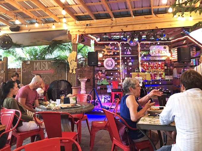The outdoor dining area feels like your coolest friend's backyard party—if that friend happened to be a culinary genius with great taste in lighting.