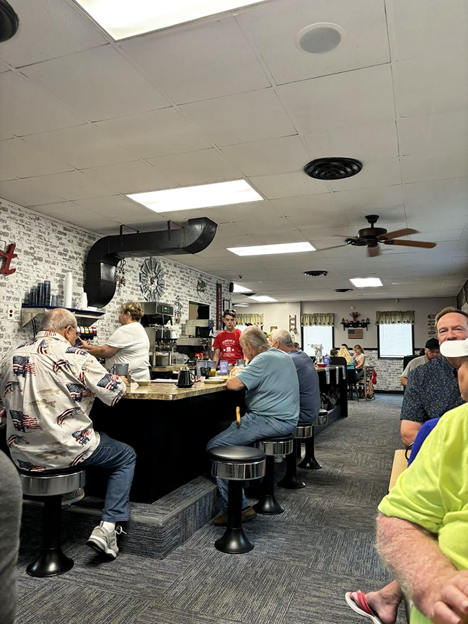 The counter seating—where solo diners become regulars and regulars become family. More friendships have started here than at most social clubs.