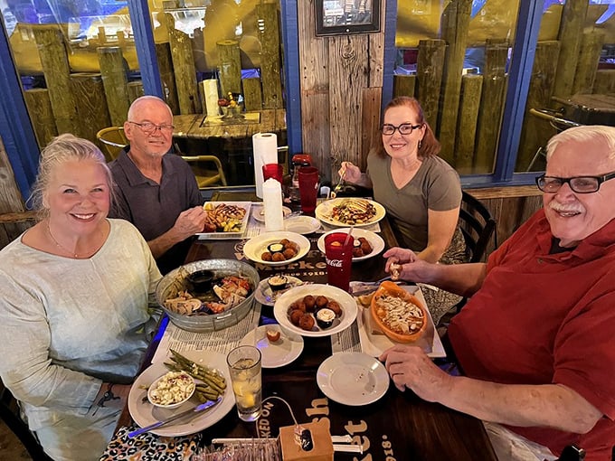 Four happy diners surrounded by a feast that would make Neptune jealous. This is what vacation memories are made of.