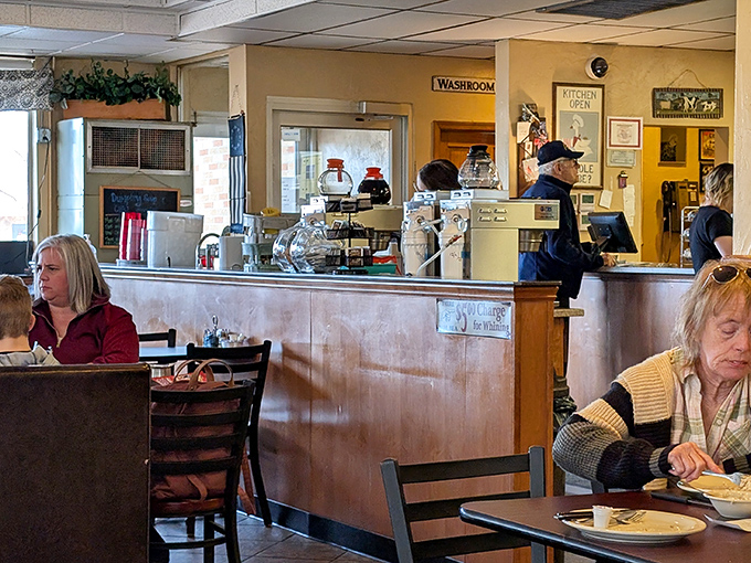 The counter area – where regulars perch, coffee flows freely, and the rhythm of small-town Wisconsin plays out daily.