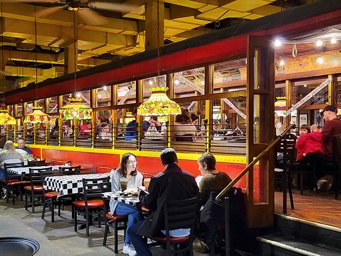 Dinner and a show—the trolley's interior offers both. Those stained glass windows filter the light like rose-colored glasses for your dining experience.